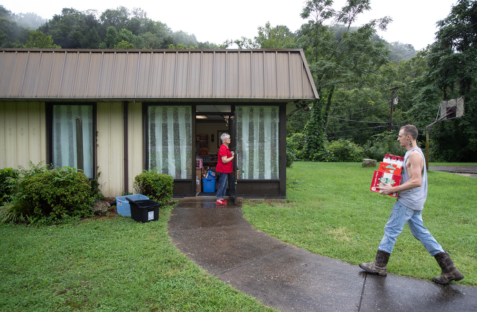 Volunteers share hugs and ‘God stories’ after flooding